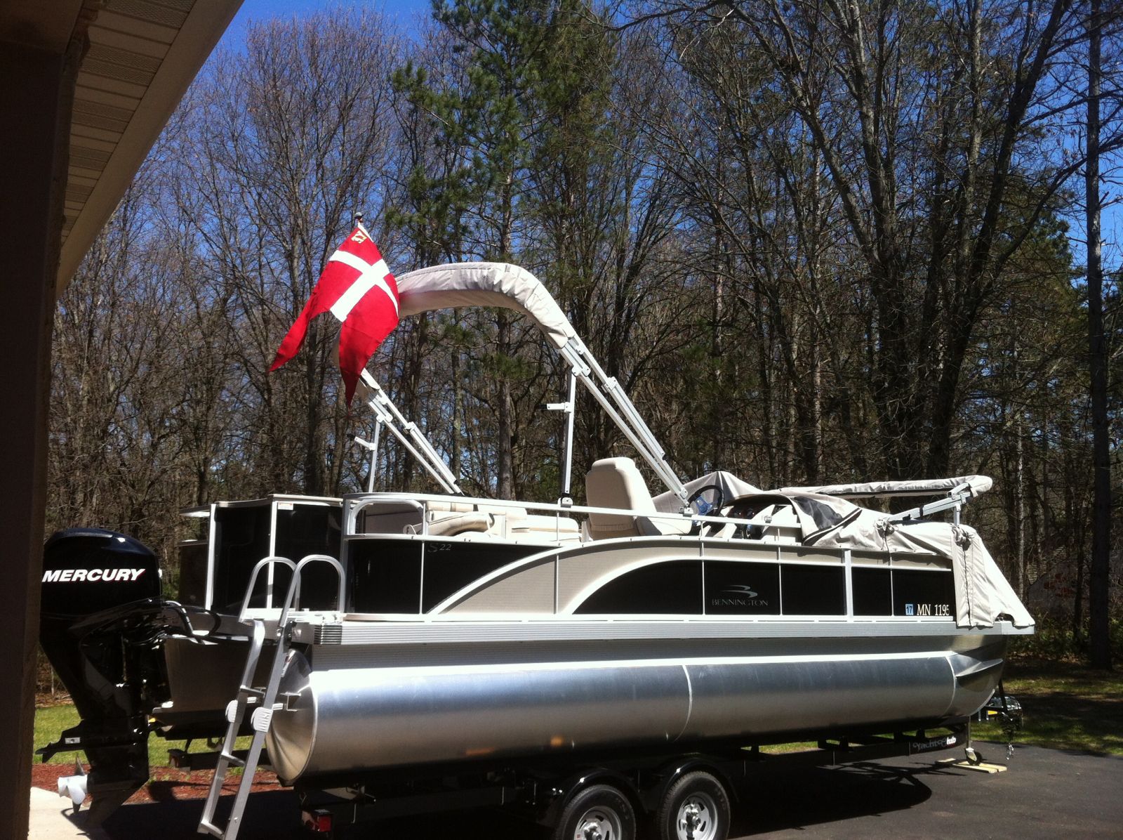 Bimini arm up, flag fluttering. | Club Bennington
